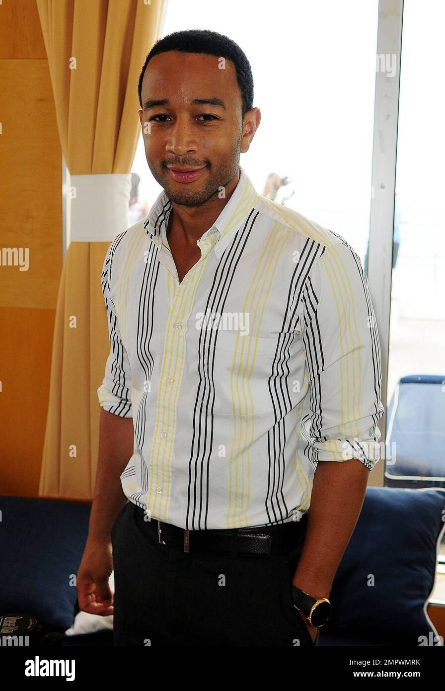 Christine Teigen, John Legend and Designer Neila Granzoti Rudden pose ...