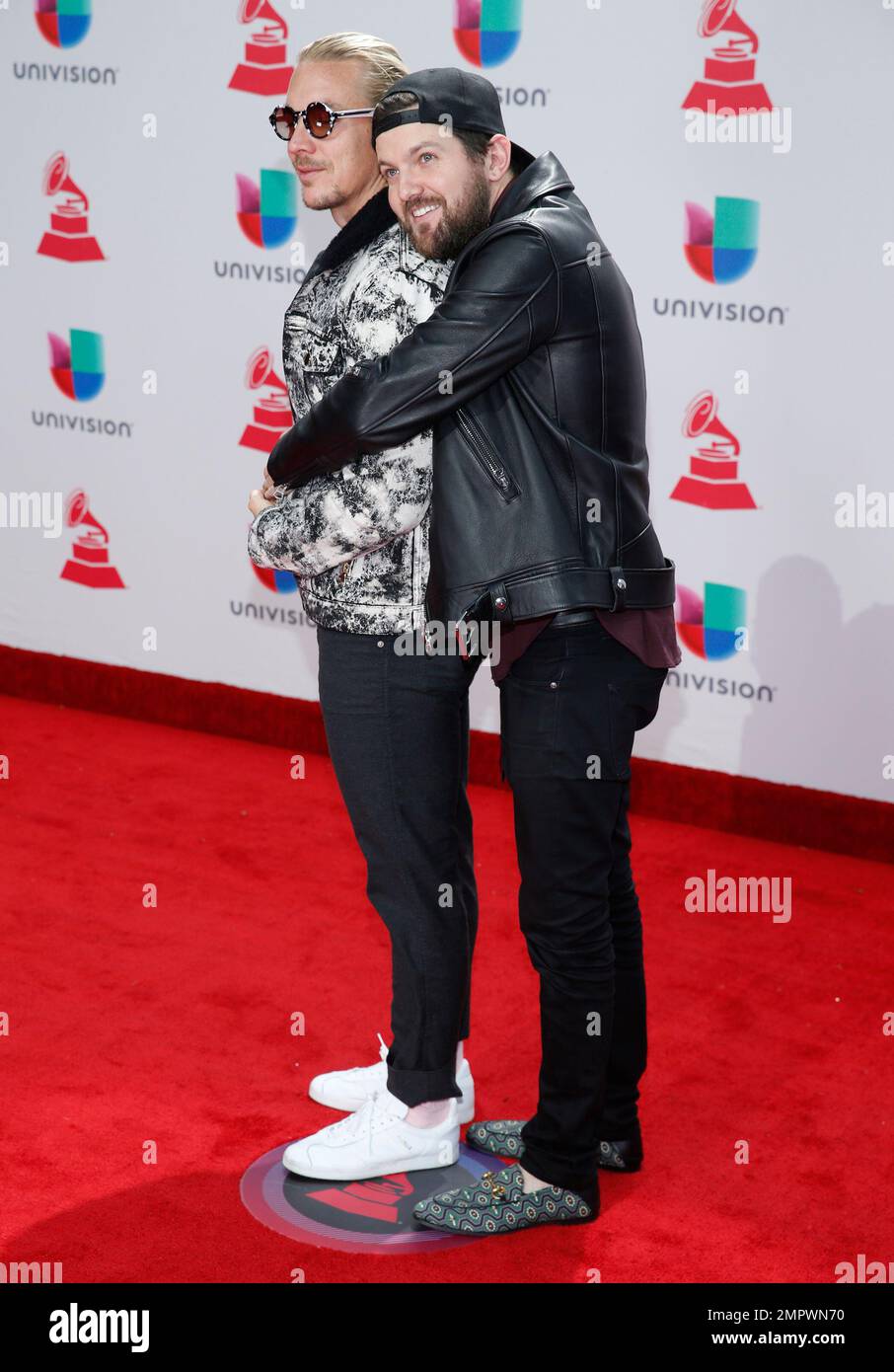 Dillon Francis, right, hugs Diplo as they arrive at the 18th annual ...