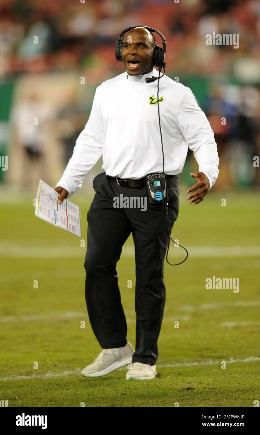 South Florida head coach Charlie Strong shouts to his players during ...