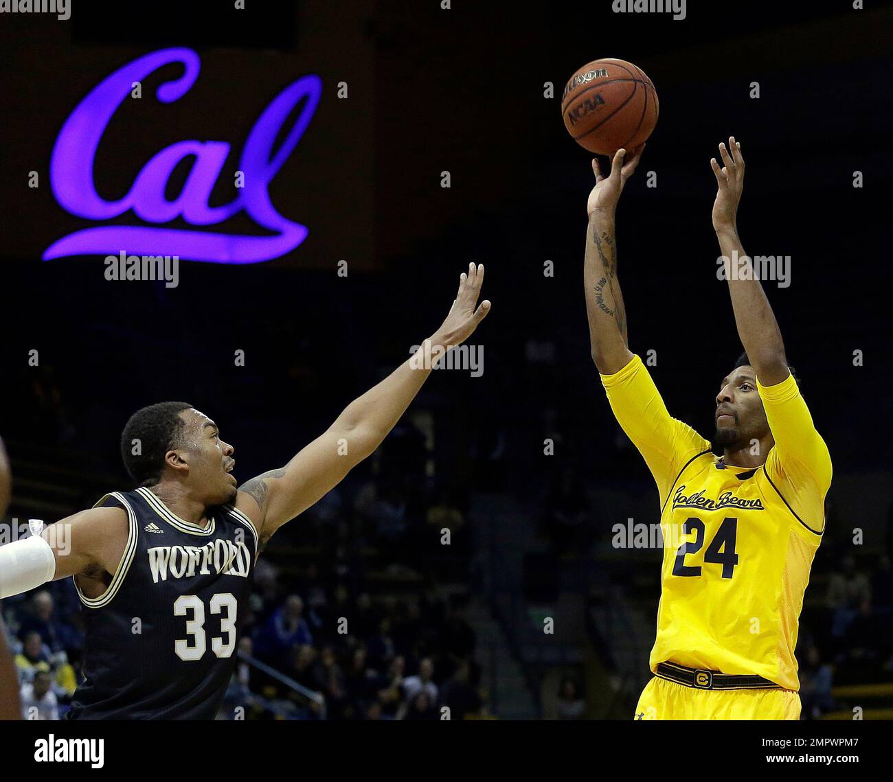California's Marcus Lee, right, shoots over Wofford's Cameron Jackson ...