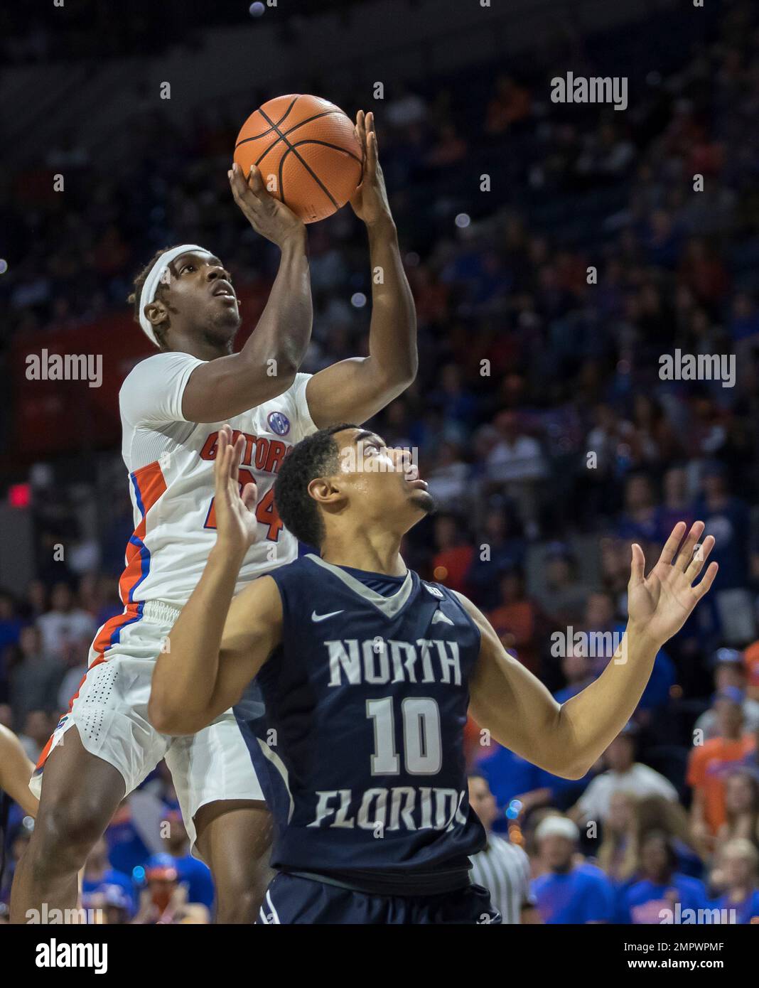 Florida guard Deaundrae Ballard (24) shoots over North Florida guard ...