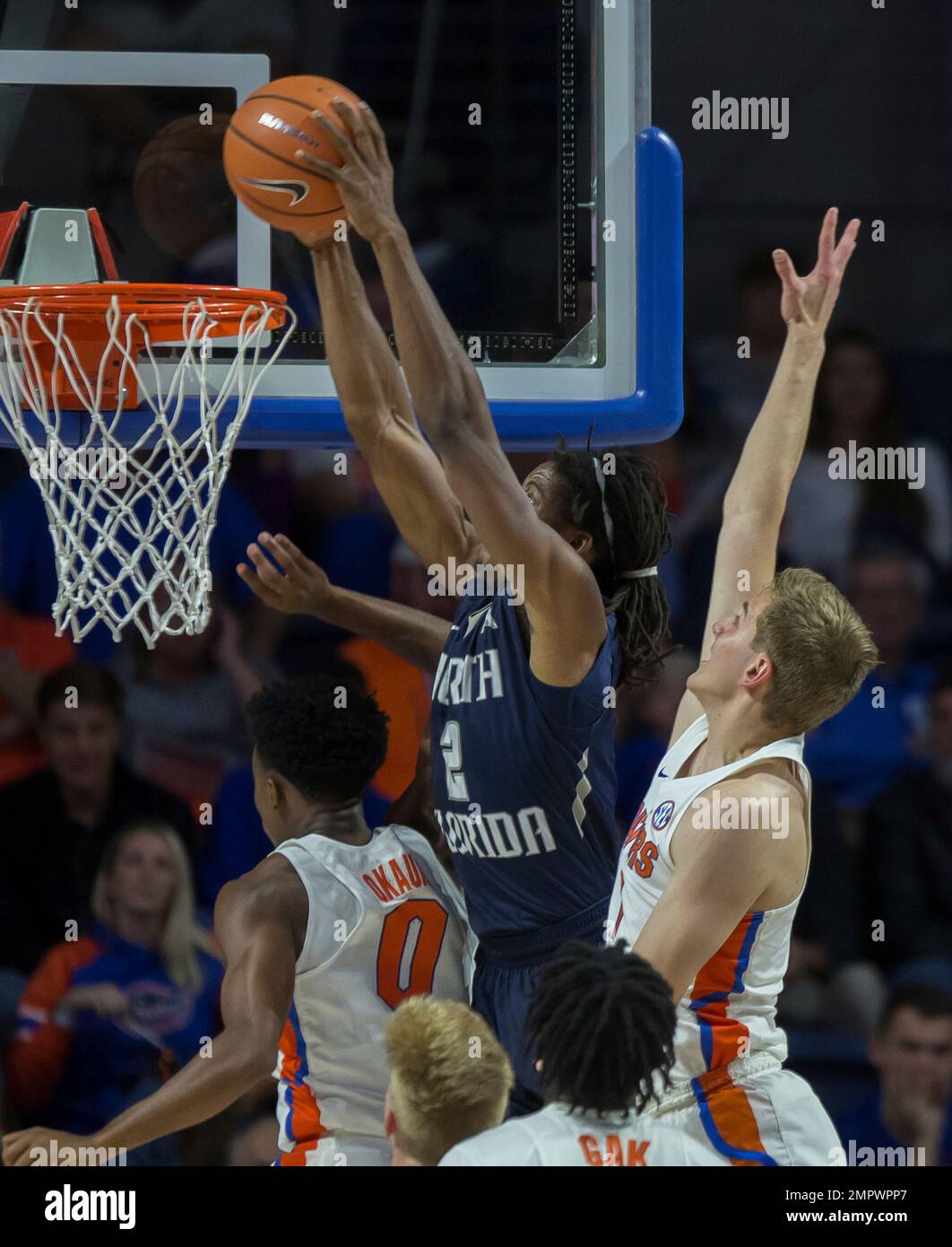 North Florida forward Wajid Aminu (2) dunks over Florida forward Chase ...