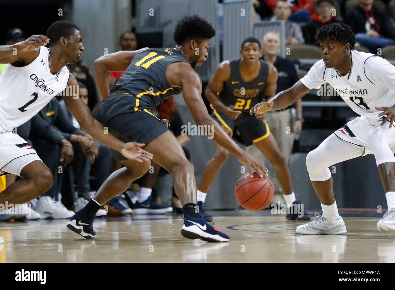 Coppin State's Joel Boyce (11) is double-teamed by Cincinnati's Keith ...