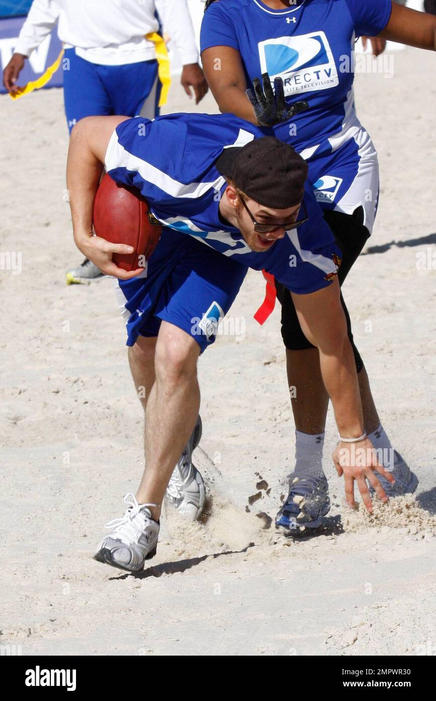 Kellan Lutz plays in the Fourth Annual DirecTV Celebrity Beach Bowl at ...