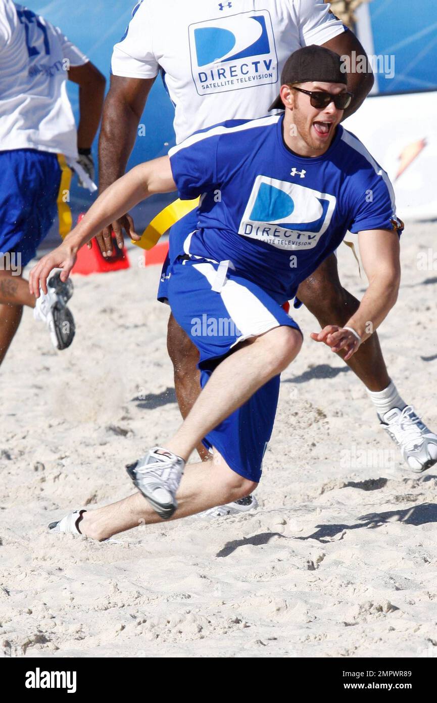 Kellan Lutz plays in the Fourth Annual DirecTV Celebrity Beach Bowl at ...