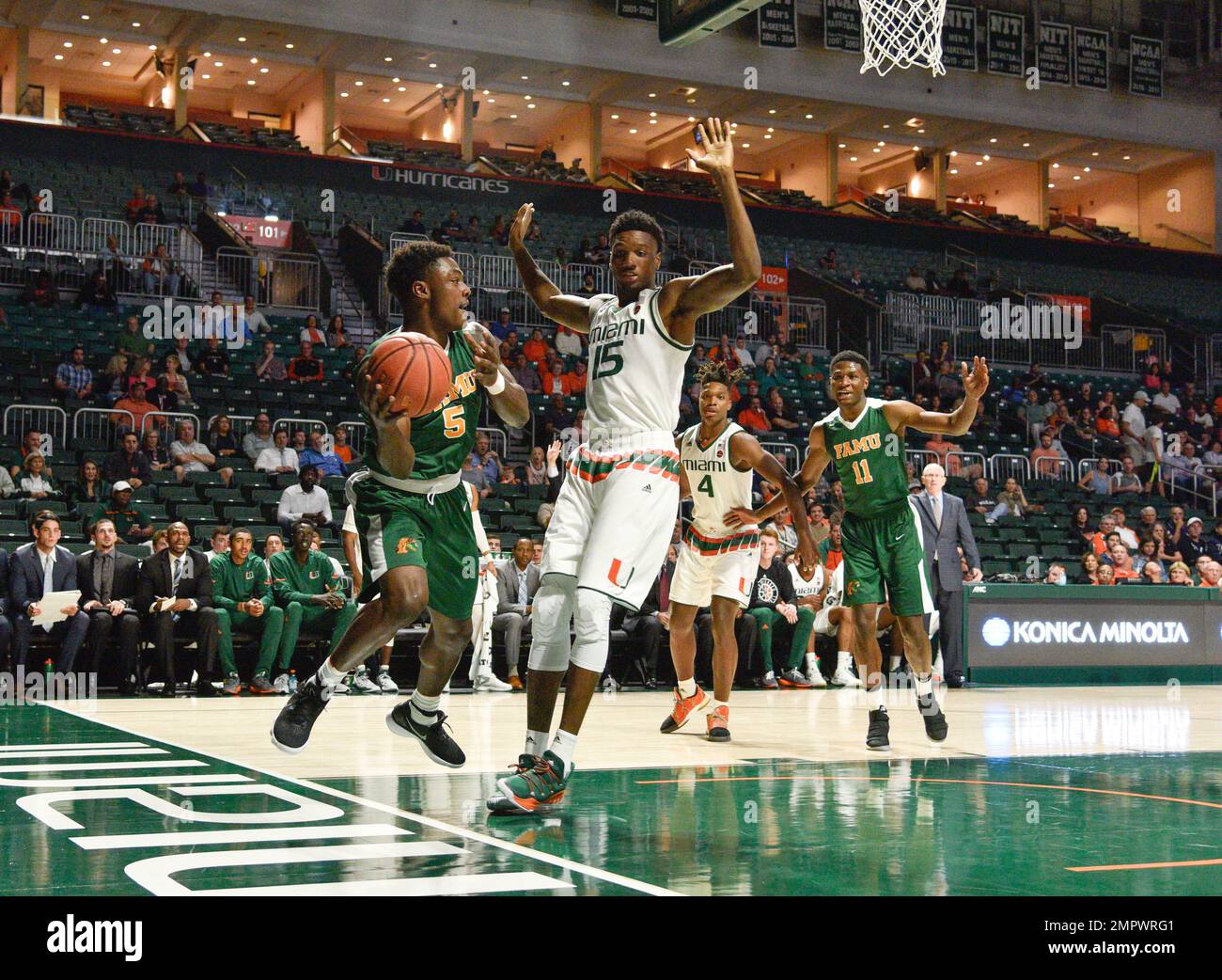 Florida A&M guard Nasir Core left, passes the ball as Miami's Mike ...