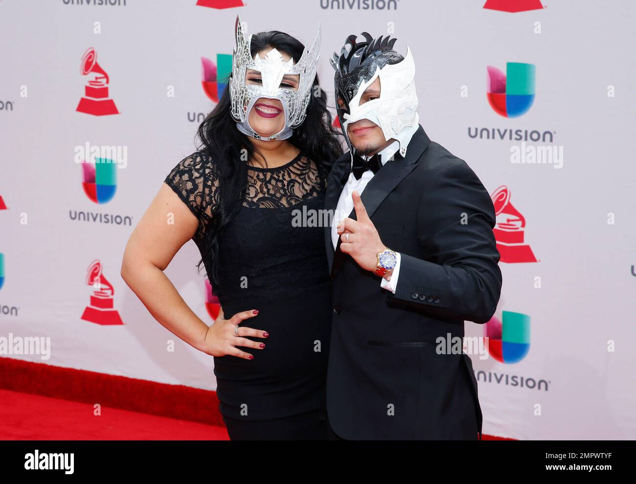Emanuel Alejandro Rodriguez, right, better known by the ring name Kalisto, and unidentified ...