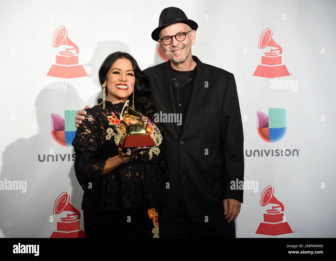 Lila Downs, left, and Paul Cohen pose in the press room with the award ...