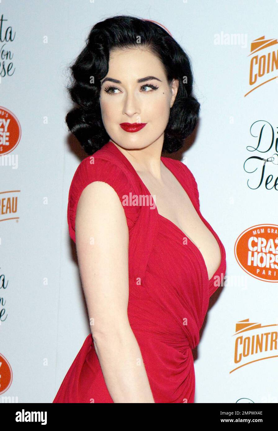 Queen of Burlesque Dita Von Teese looks stunning in a flowing red gown on the red carpet at her ...