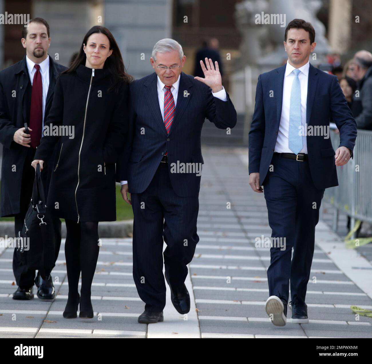 U.S. Sen. Bob Menendez, center, walks with his son, Rob, right, and his ...
