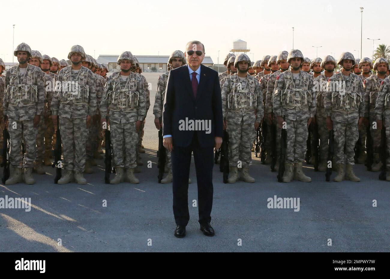 Turkey's President Recep Tayyip Erdogan, centre, poses for photographs ...