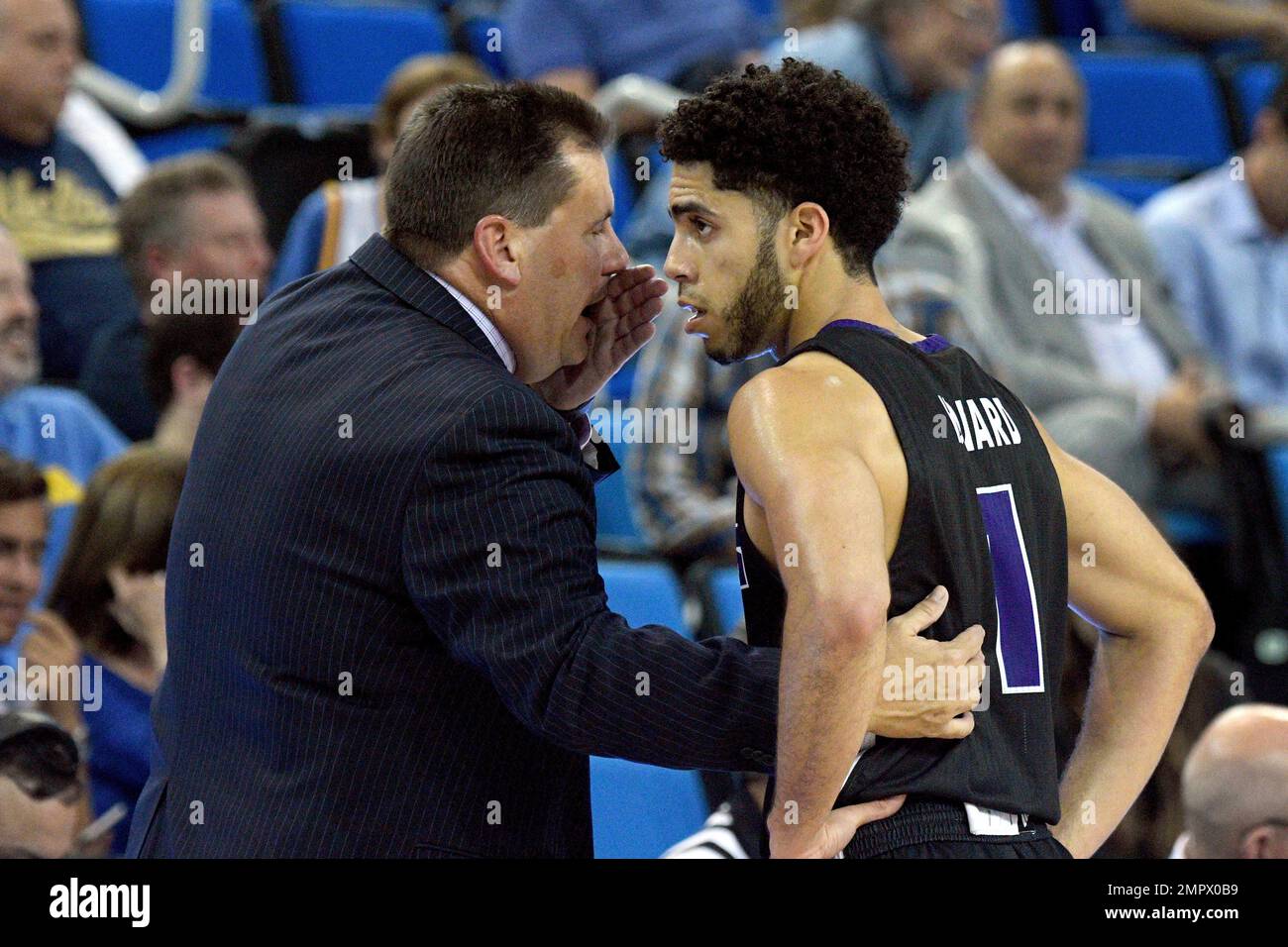 Central Arkansas head coach Russ Pennell talks with guard Jordan Howard ...