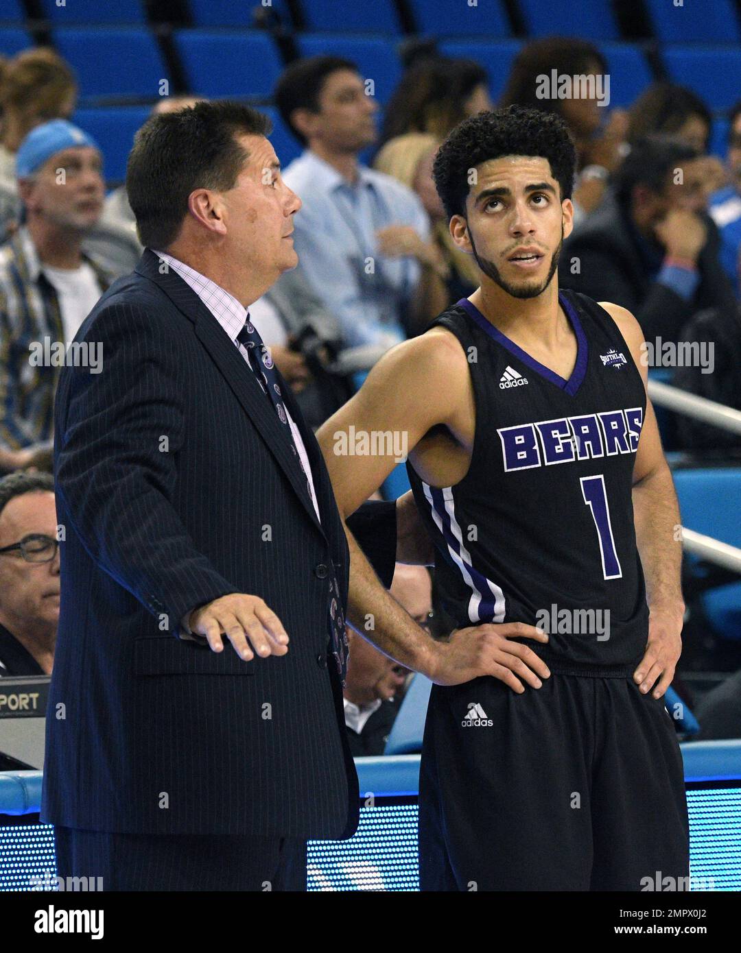 Central Arkansas head coach Russ Pennell talks with guard Jordan Howard ...