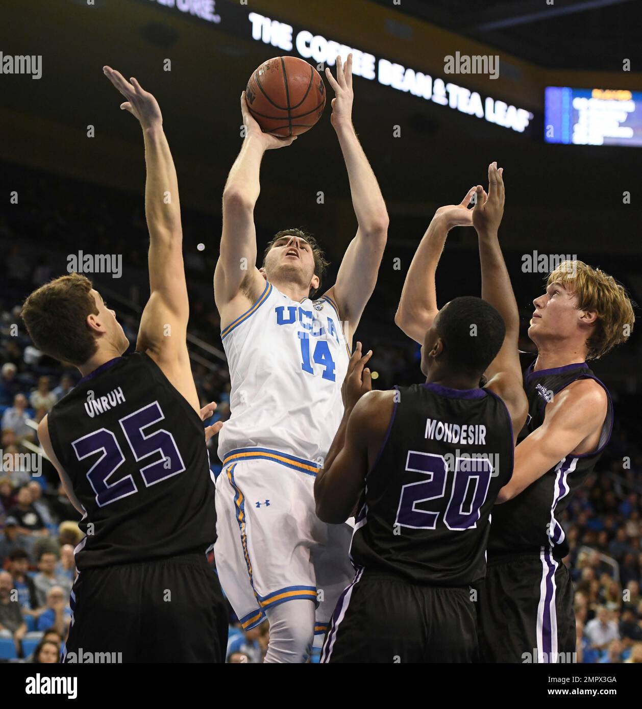UCLA's Gyorgy Goloman (14) shoots against Central Arkansas' Thatch ...