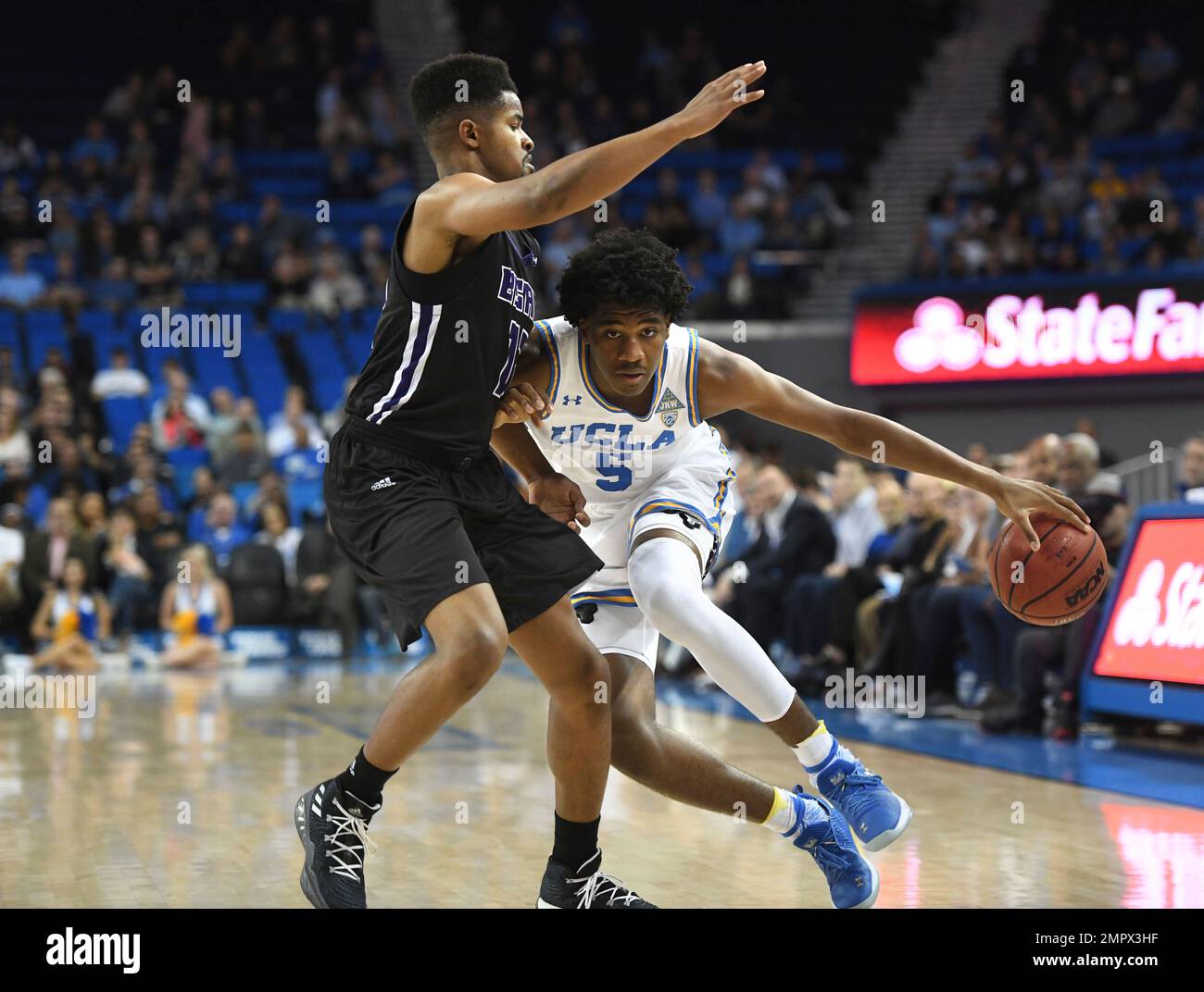 UCLA guard Chris Smith (5) drives against Central Arkansas' Darraja ...