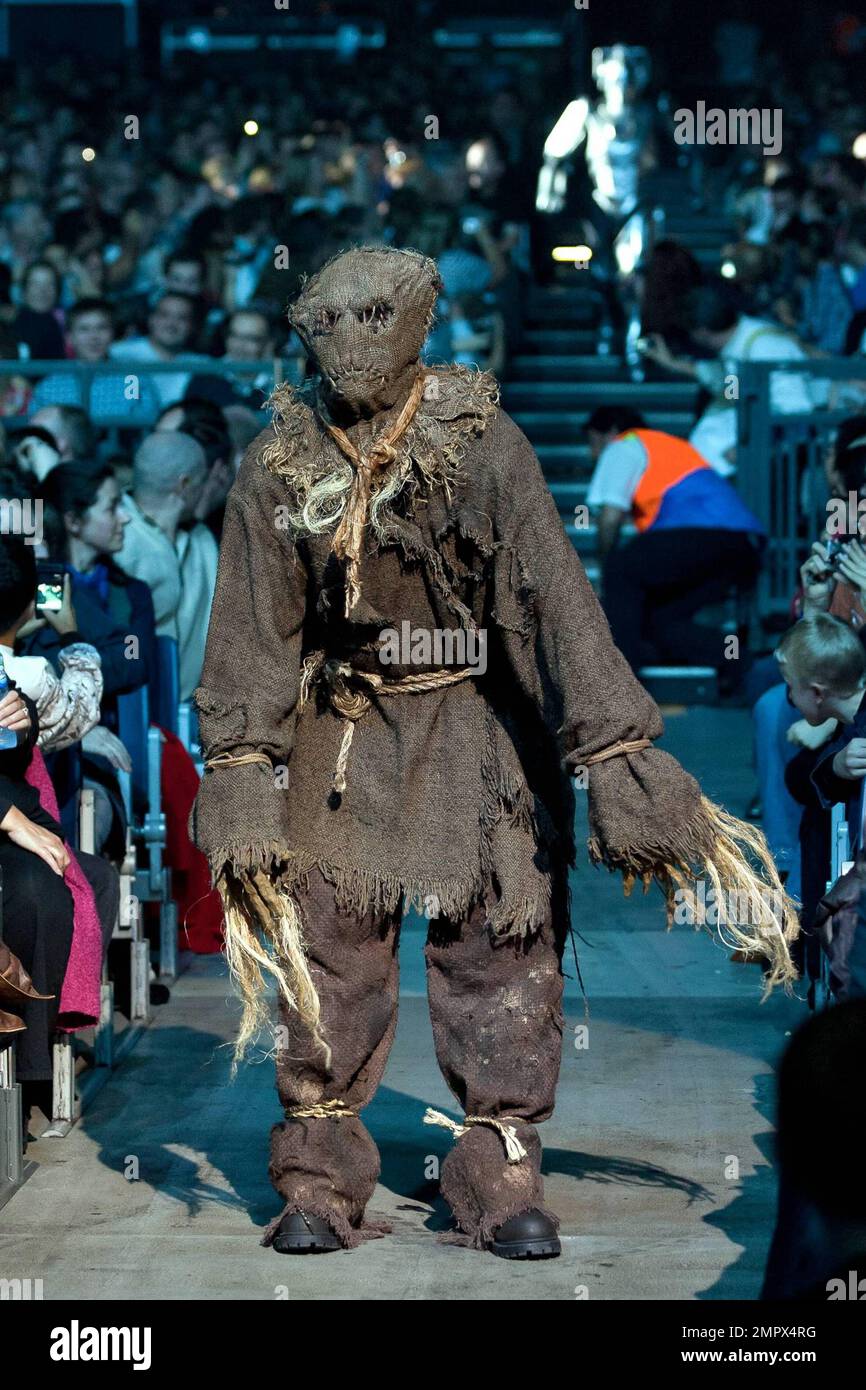 A Scarecrow Monster walks down through the crowd at the "Doctor Who ...