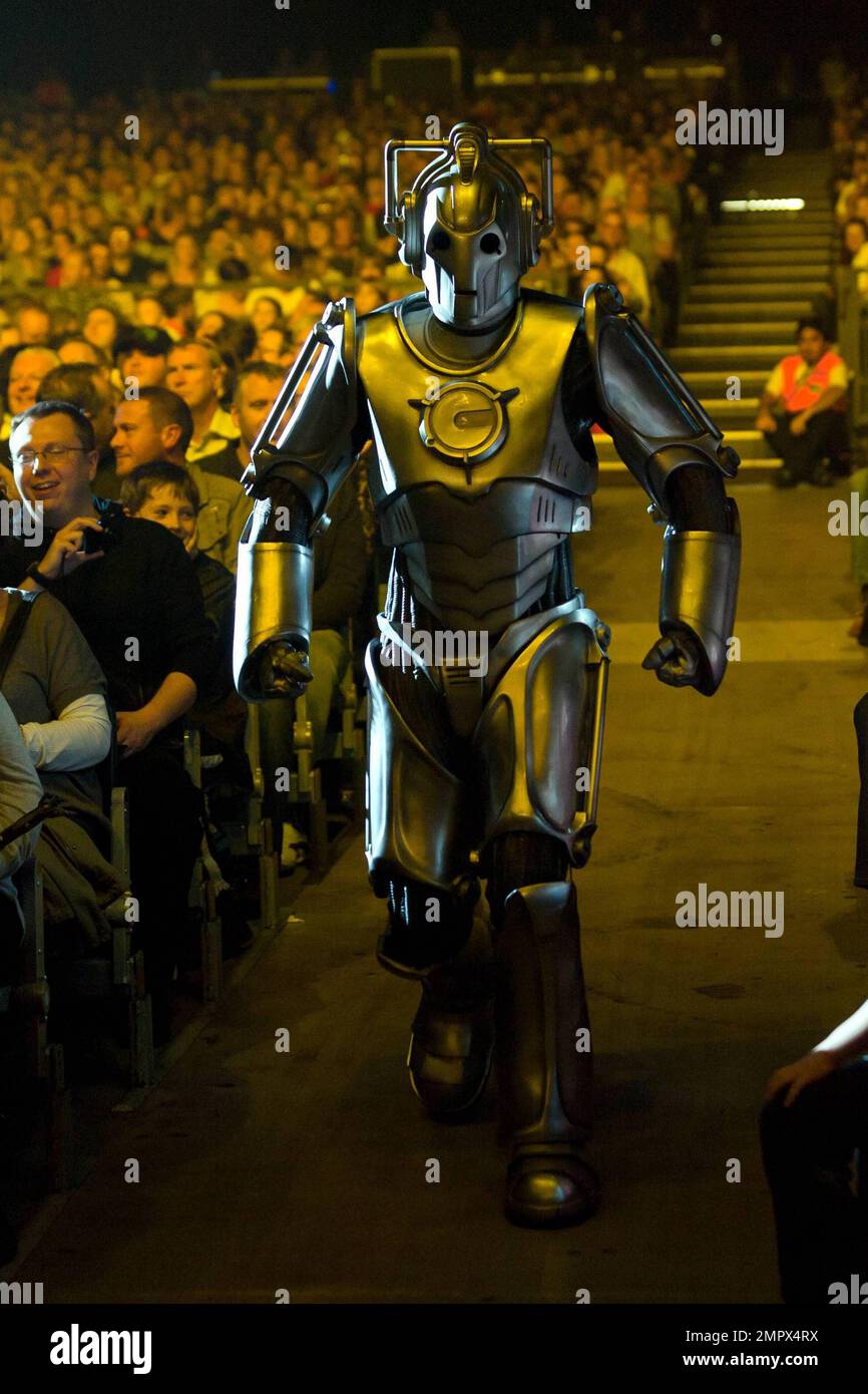 A Cyberman Monster walks down through the crowd at the "Doctor Who Live ...
