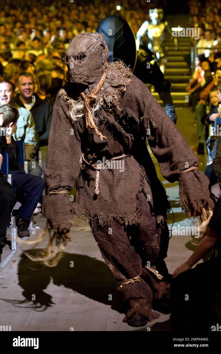A Scarecrow Monster walks down through the crowd at the "Doctor Who ...