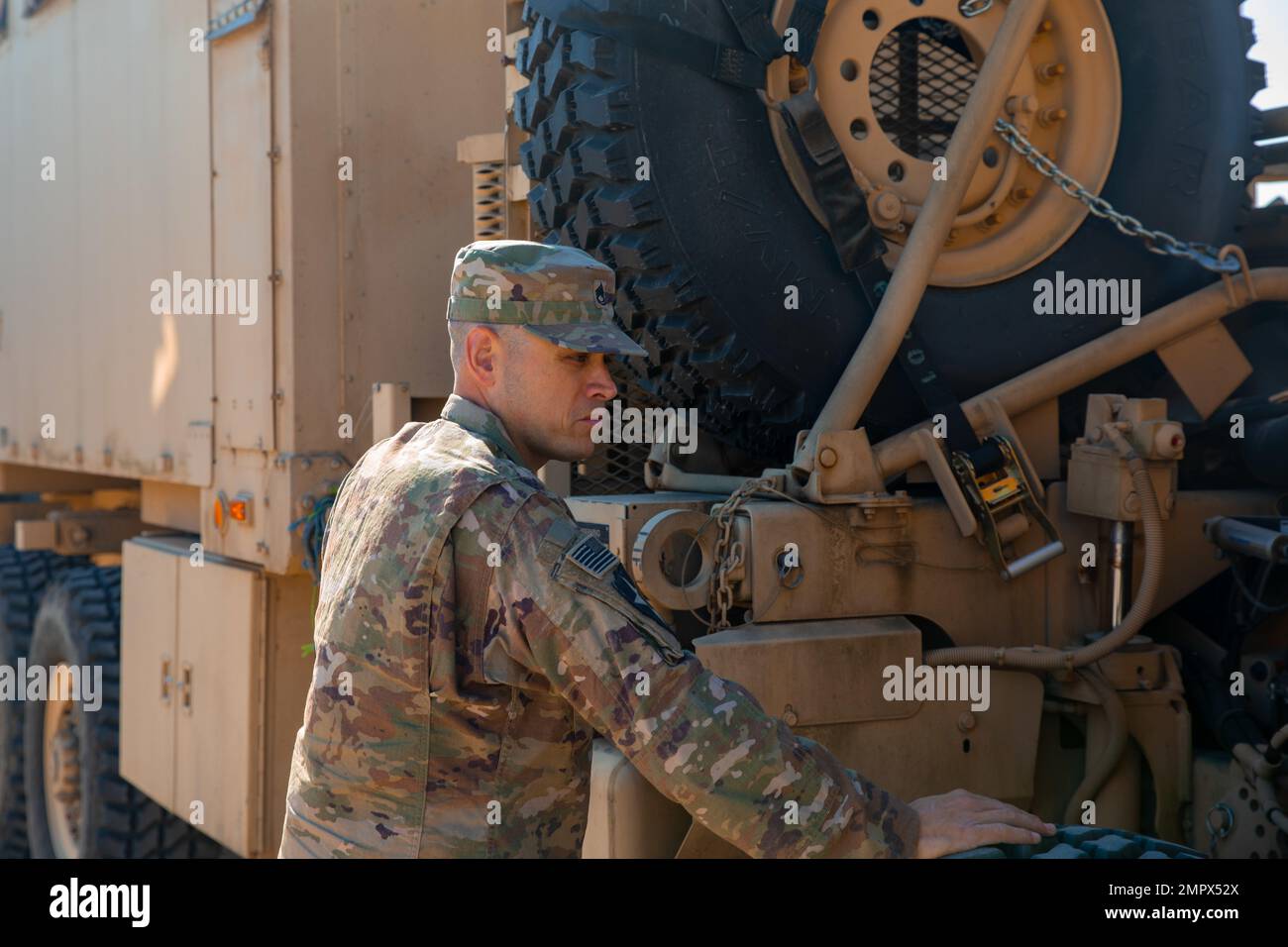 U.S. Army Sgt. 1st Class Thomas Fisher, an engineer project manager ...