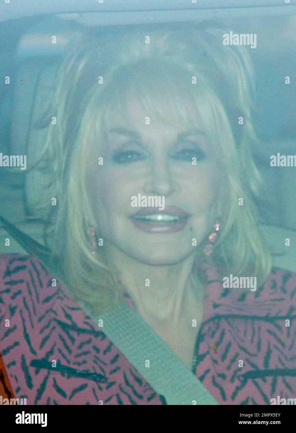 Busty country music legend Dolly Parton shows off her big smile while ...