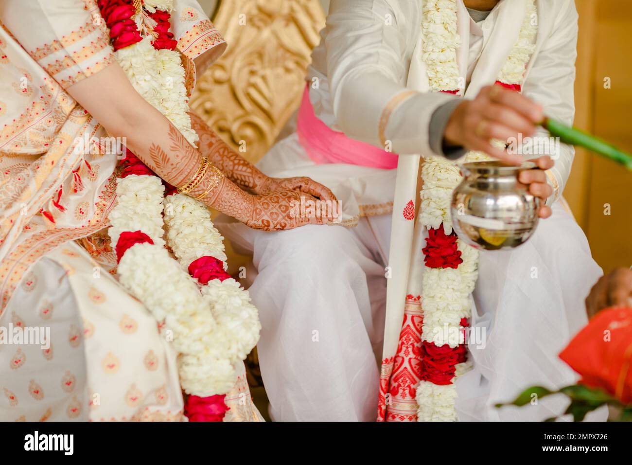 The Bride and Groom at the Indian Wedding with Garlands Stock Photo - Alamy