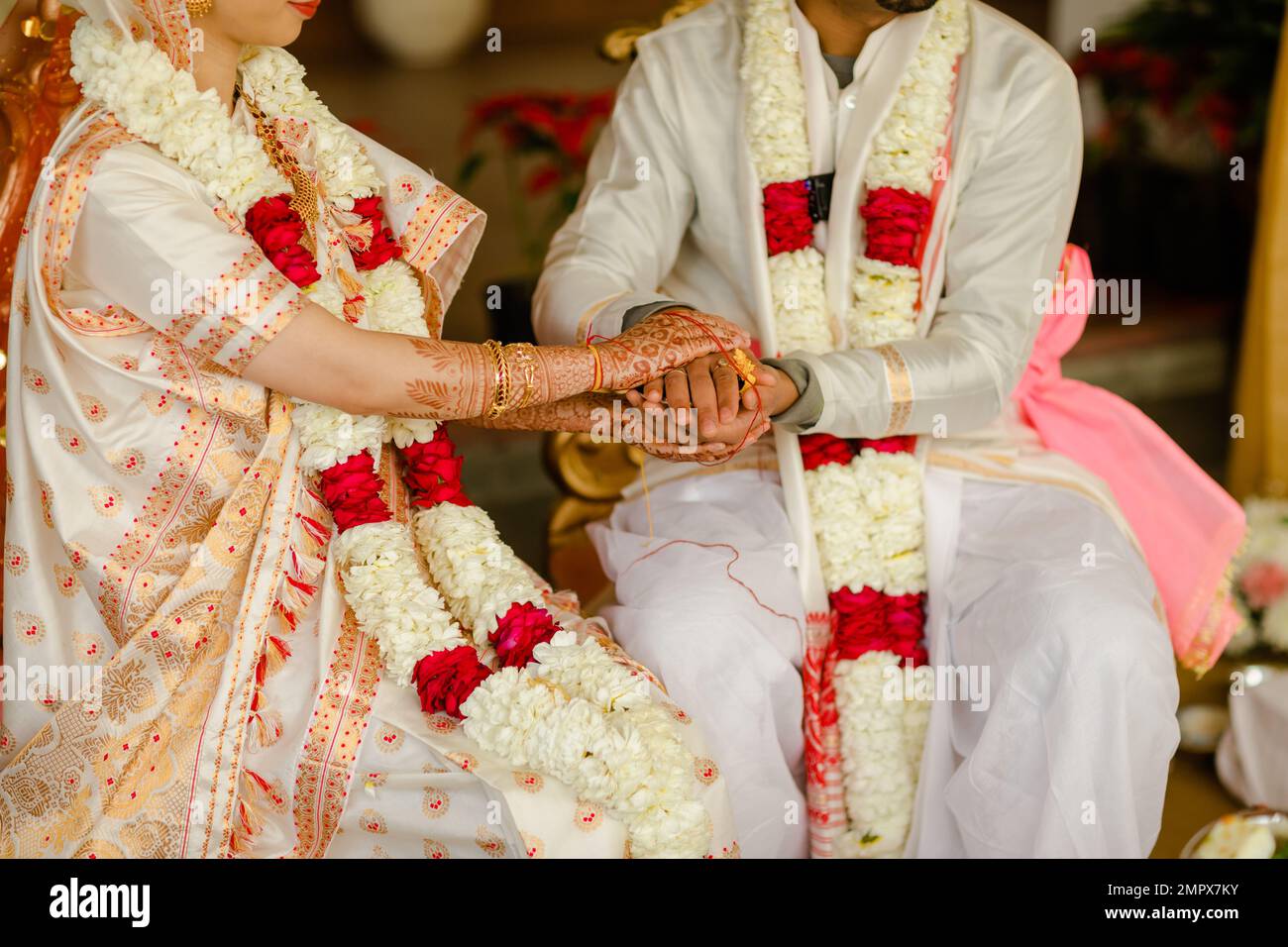 The Bride and Groom at the Indian Wedding with Garlands Stock Photo - Alamy