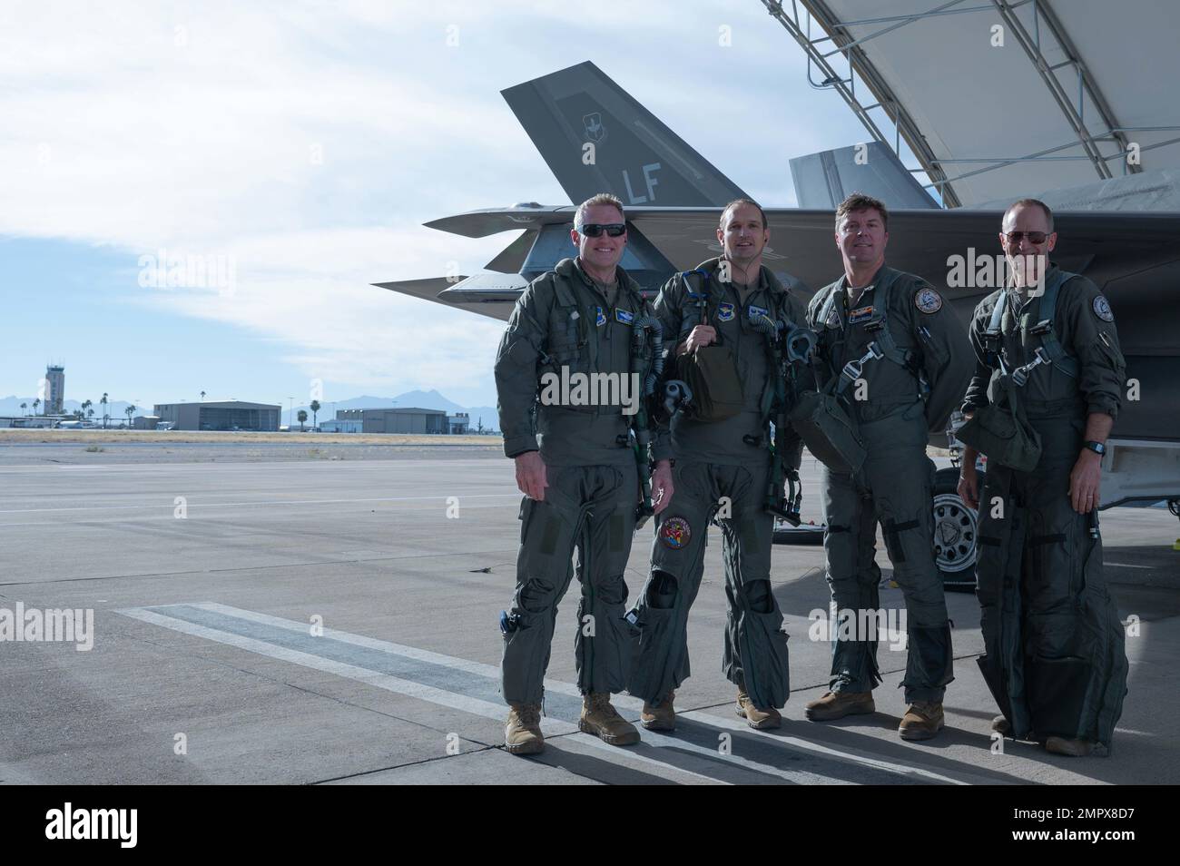 From left, Brig. Gen. Jason M. Rueschhoff, 56th Fighter Wing commander ...