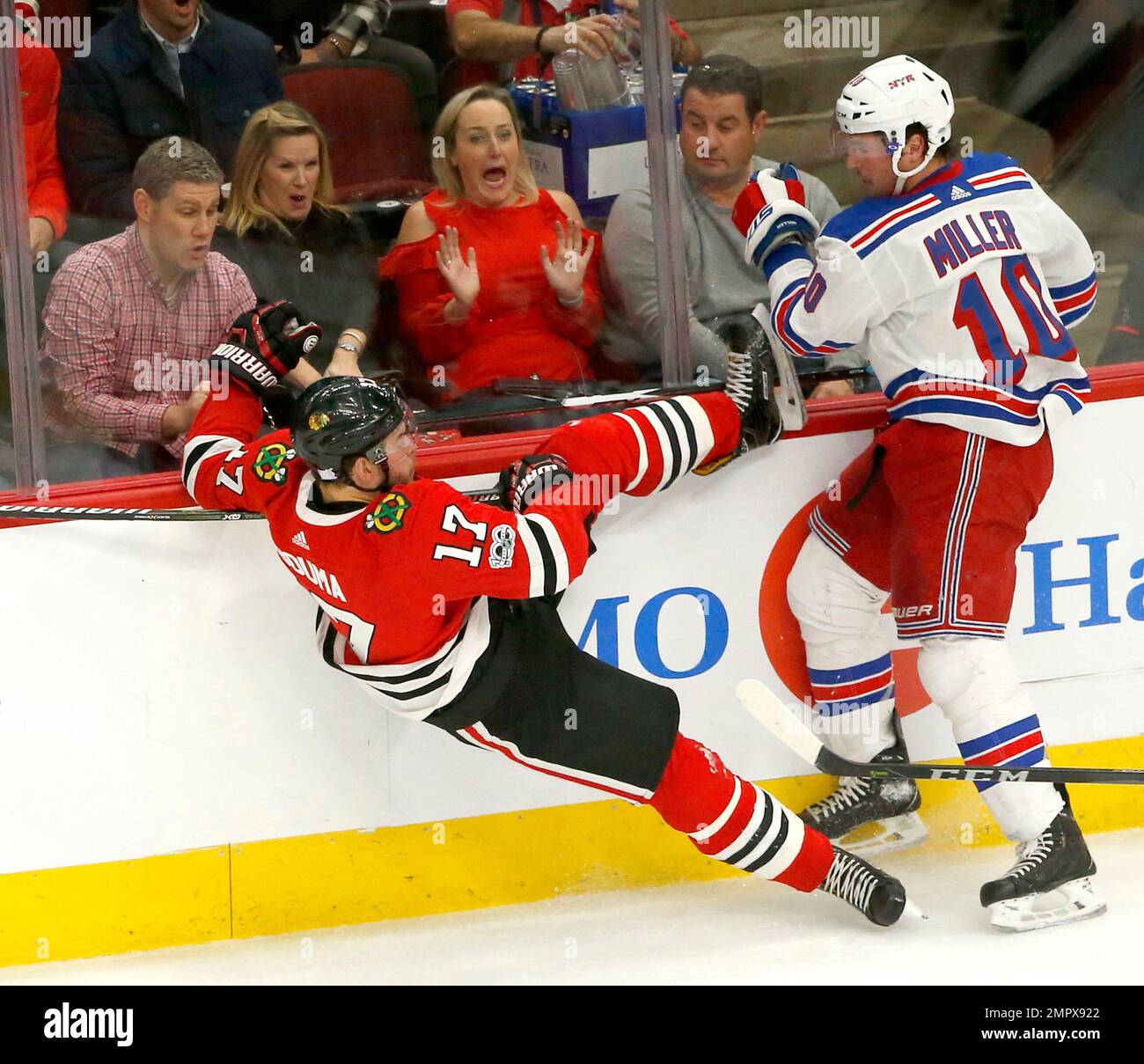 New York Rangers' J.T. Miller (10) checks Chicago Blackhawks' Lance ...