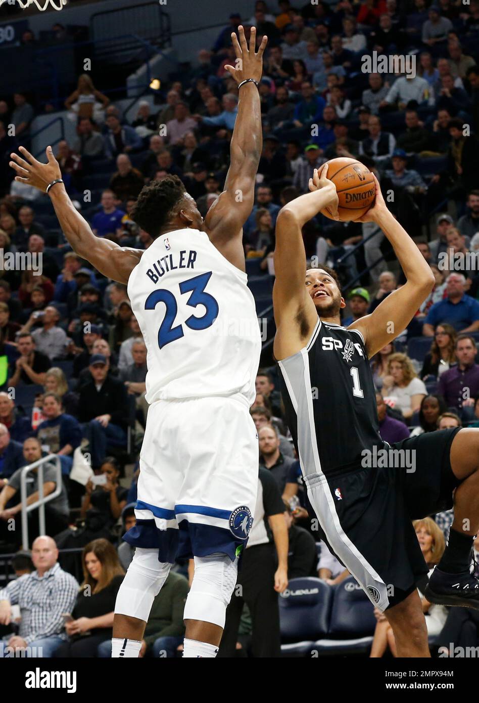 San Antonio Spurs' Kyle Anderson, right, shoots as Minnesota ...