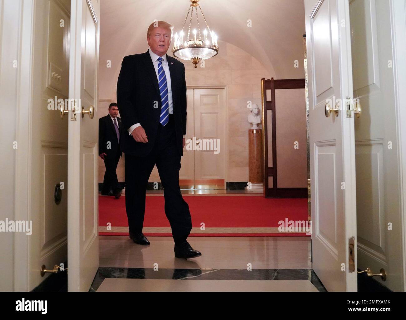 President Donald Trump arrives at the Diplomatic Reception Room of the ...