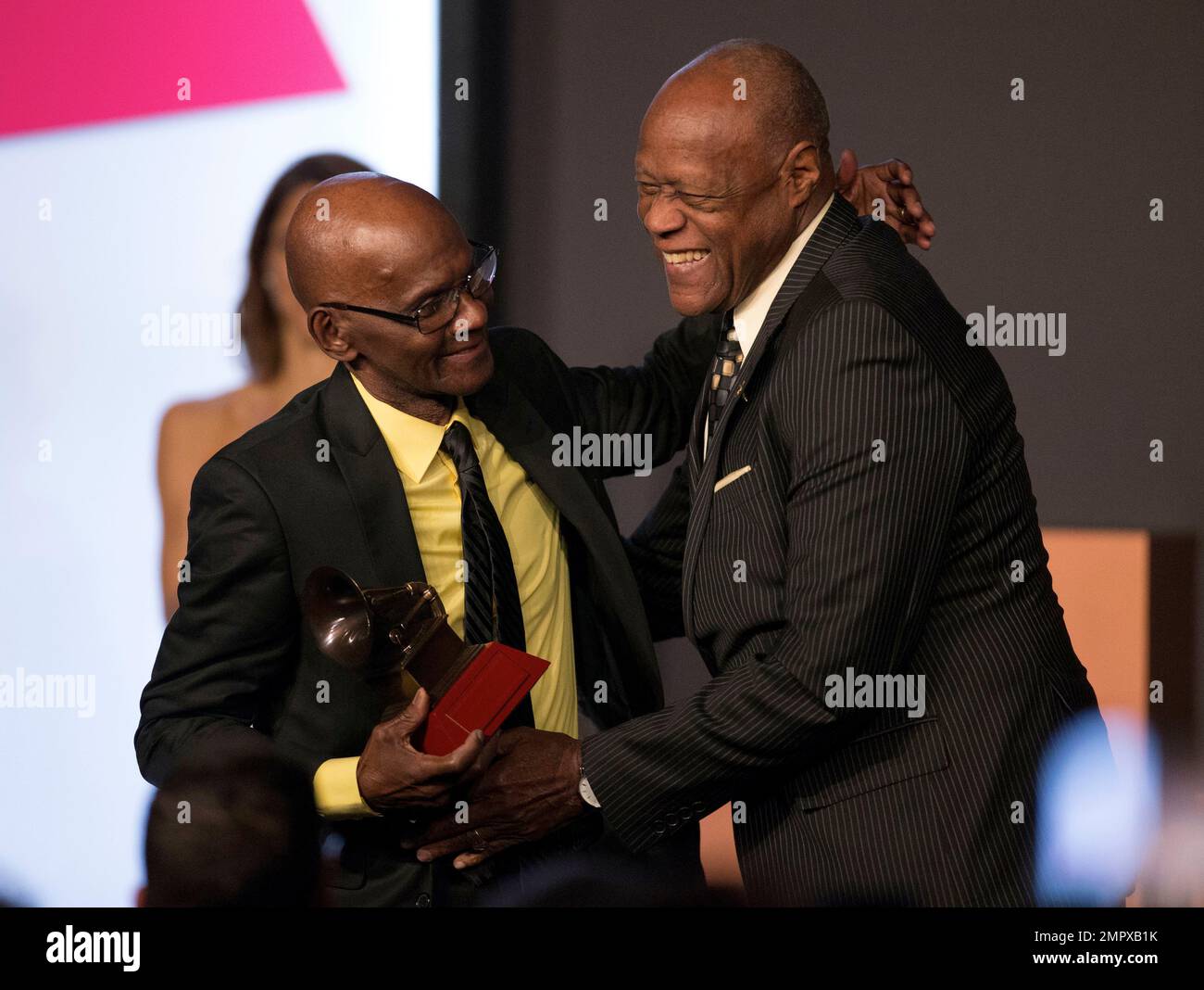Cuco Valoy, left, is presented with the lifetime achievement award by ...
