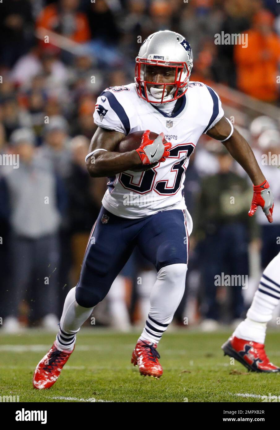 New England Patriots running back Dion Lewis runs against the Denver ...