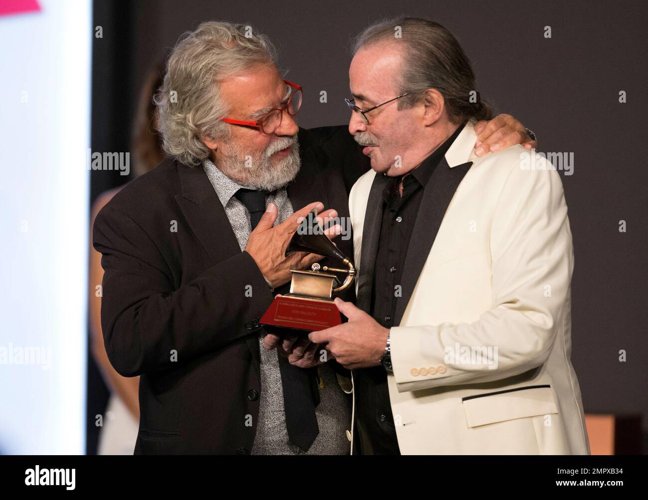 Oscar Gomez, left, presents Jon Fausty with the trustees award at the ...