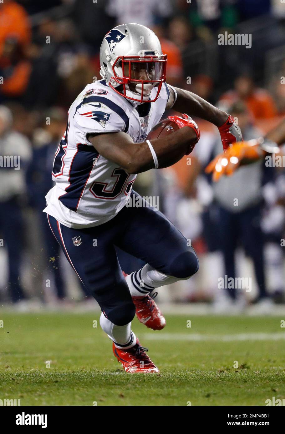 New England Patriots running back Dion Lewis runs against the Denver ...