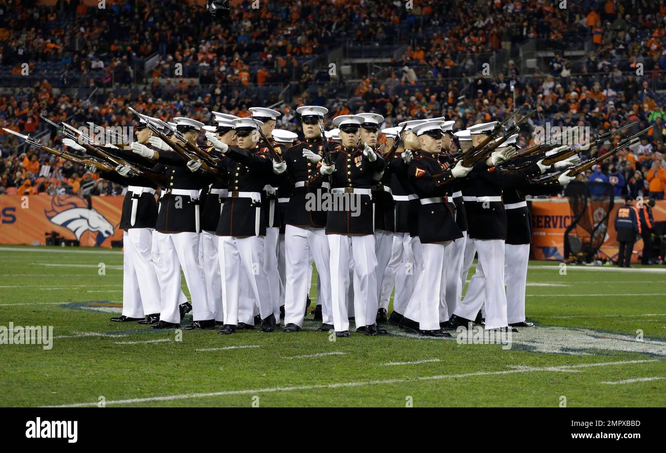 Members of the Marine perform during half time of an NFL football game ...