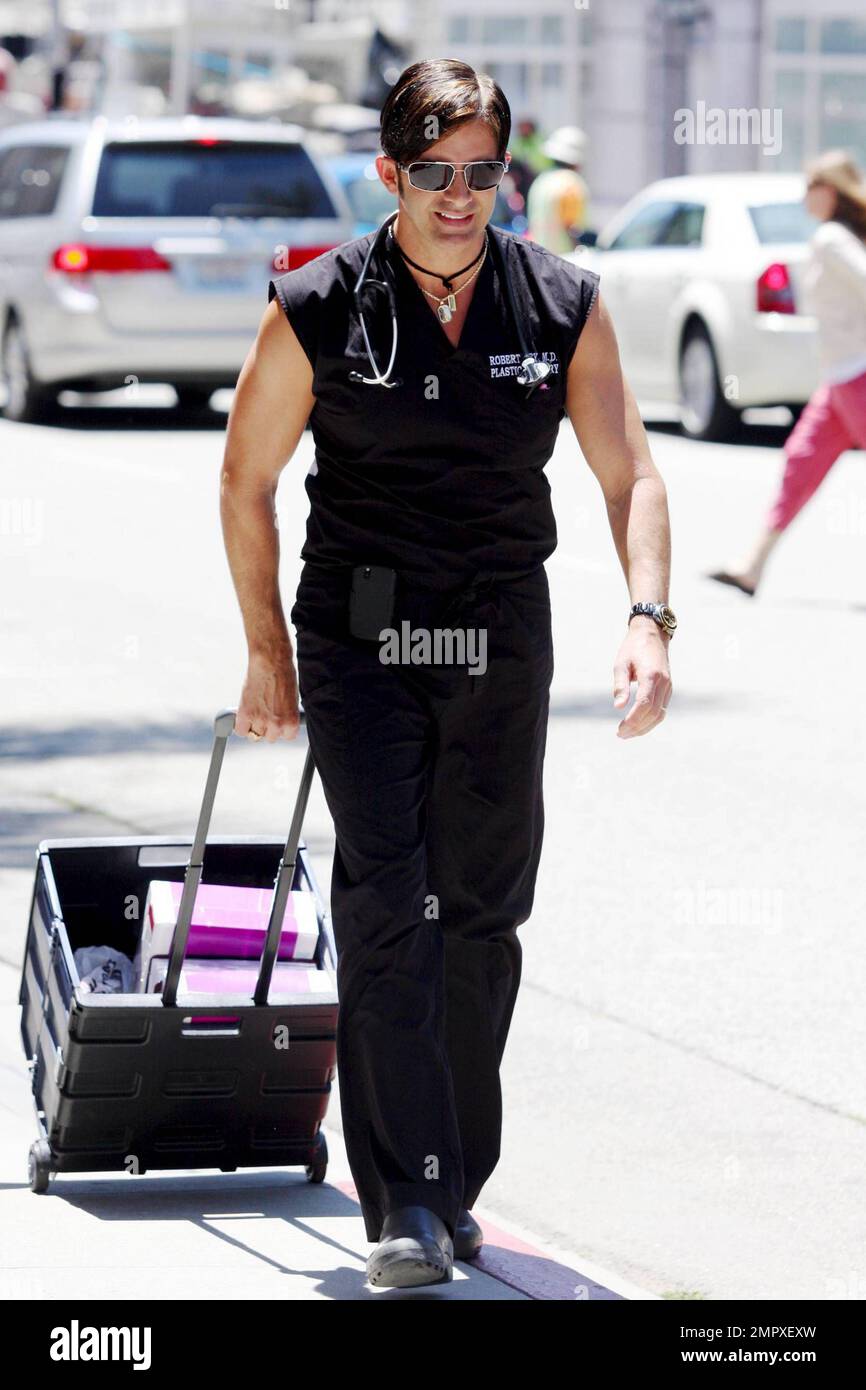 With a stethoscope around his neck, plastic surgeon Robert Rey (aka Dr ...
