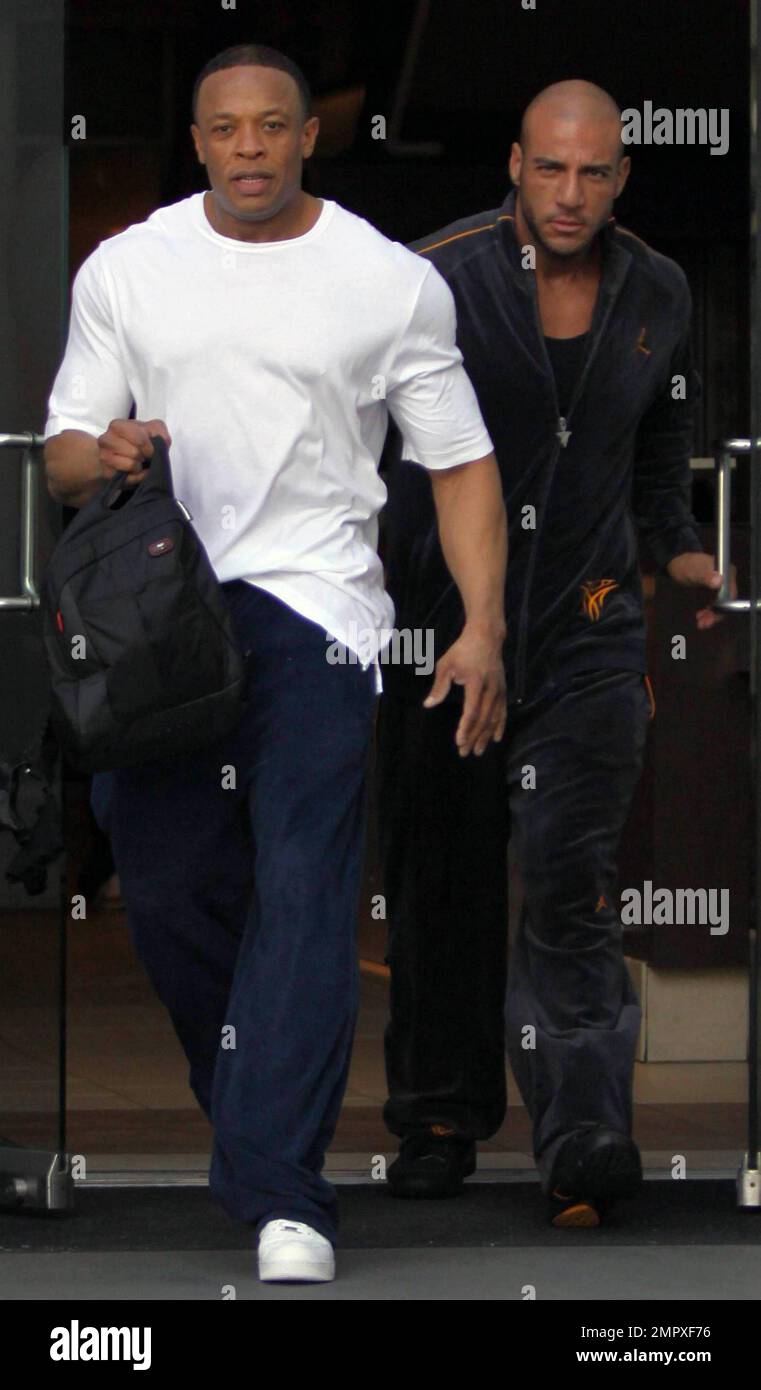 Rap music mogul Dr. Dre looks pumped up as he leaves the gym with a friend in West Hollywood, CA ...