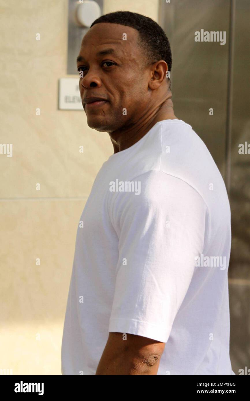 Rap music mogul Dr. Dre looks pumped up as he leaves the gym with a ...
