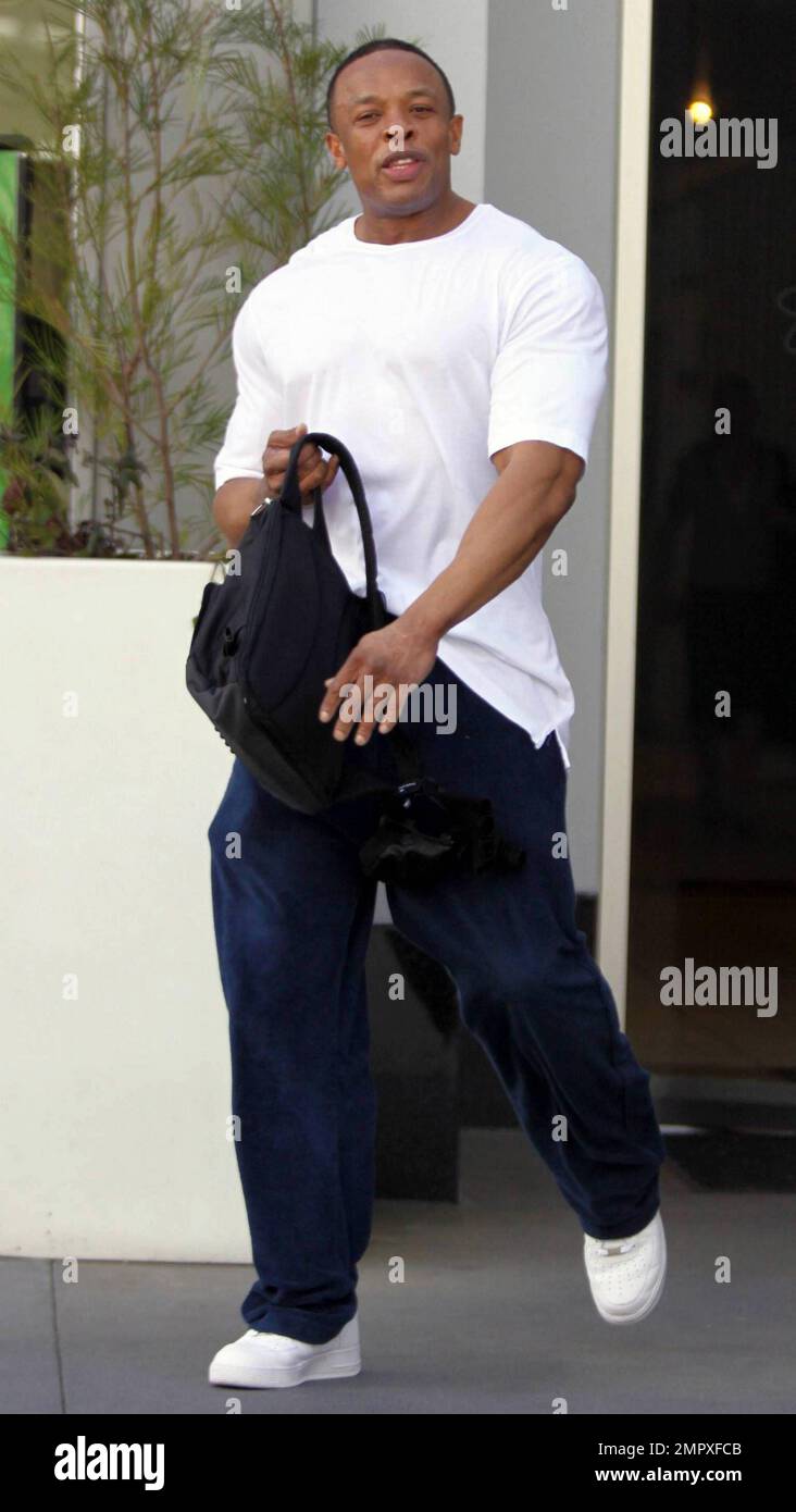 Rap music mogul Dr. Dre looks pumped up as he leaves the gym with a ...