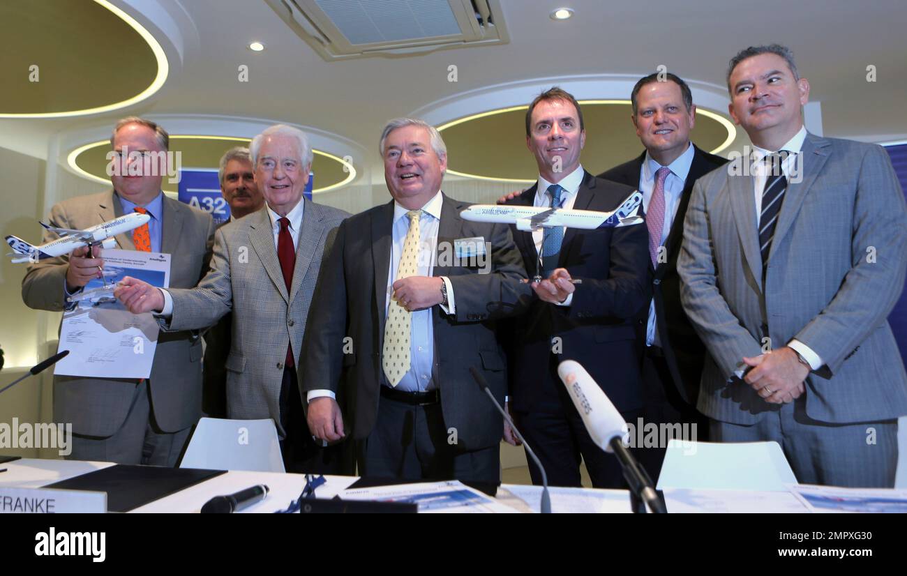 From left to right, Barry Biffle, chief executive officer of Frontier Airlines, Barry Eccleston ...