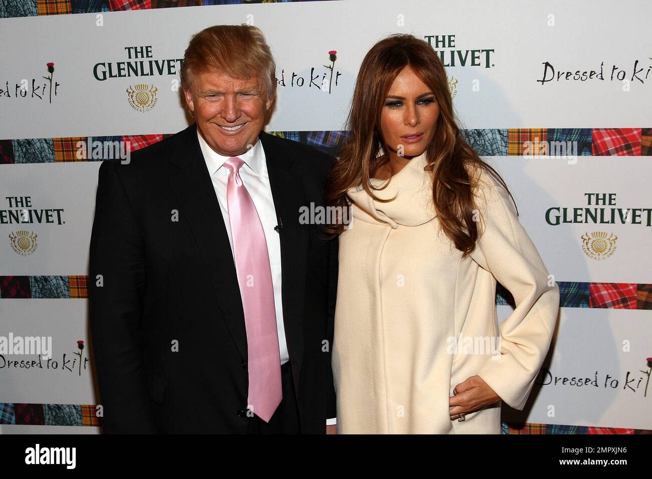 Donald Trump and Melania Trump pose for photographers at the 9th Annual ...