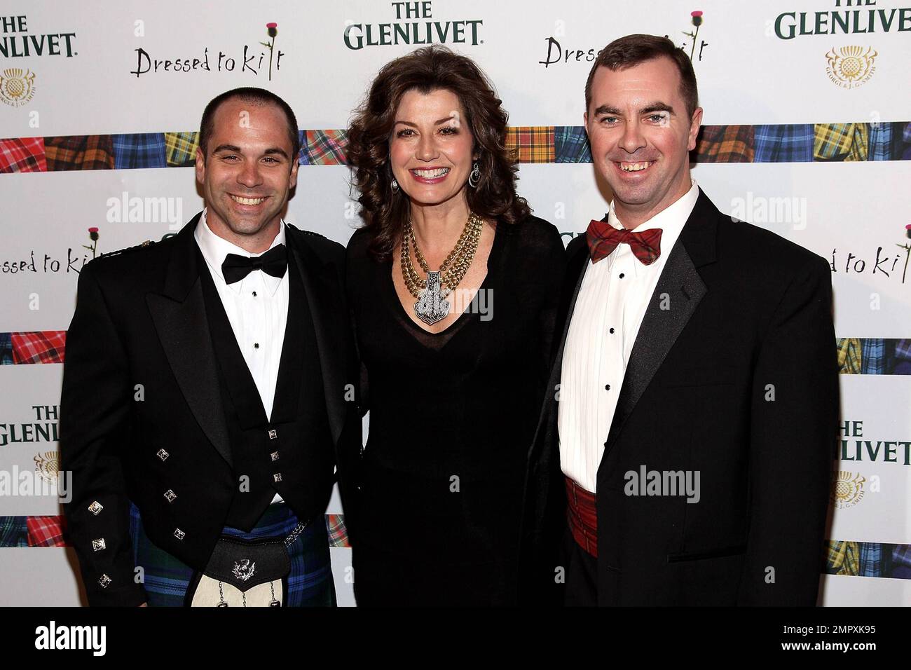 (L-R) Brian Jones, singer Amy Grant and Carl Blake pose for ...