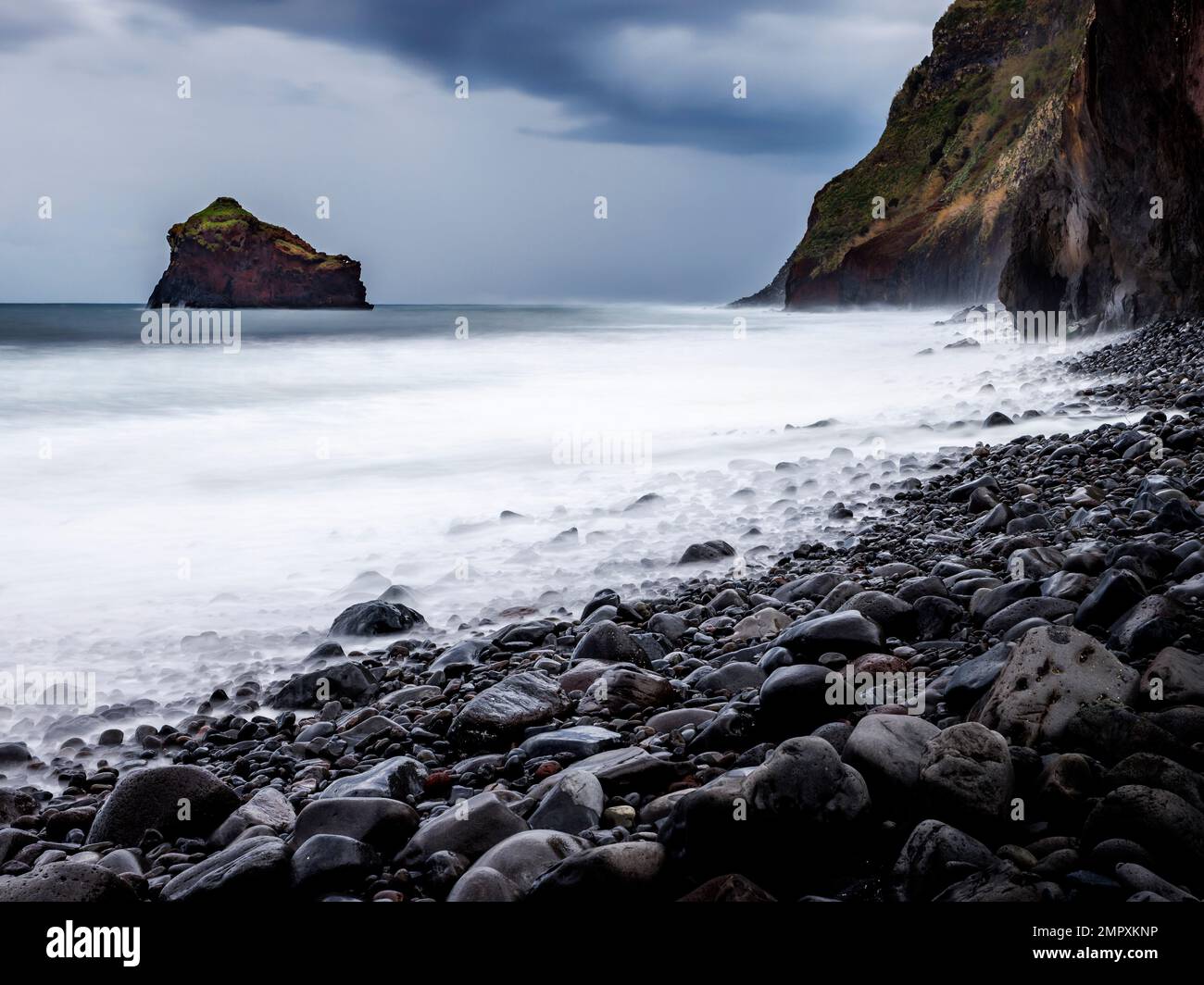 A long-exposure shot of Madeira beach with rocks and stones Stock Photo ...