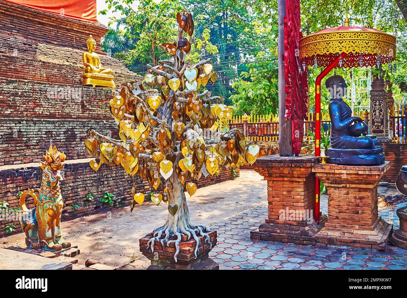 The sculpture of singha lion, gilt Bodhi tree and Buddha image with ...