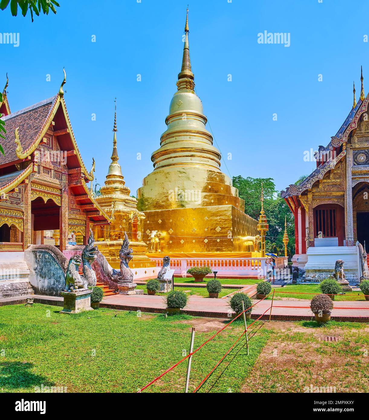 Wat Phra Singh temple complex with golden Phra That Luang chedi (stupa ...