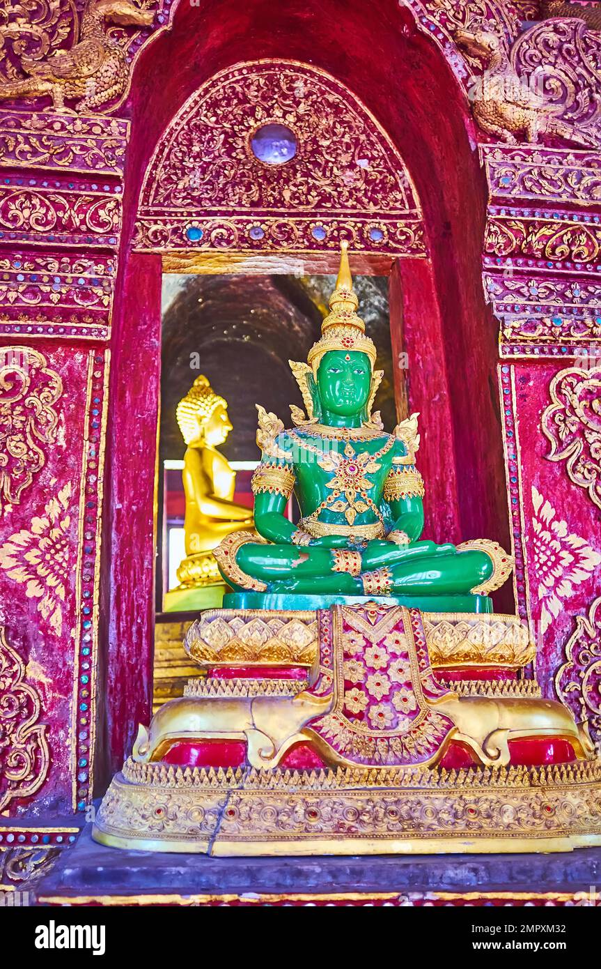The copy of the Emerald Buddha in niche of the mondop tower in Ubosot ...