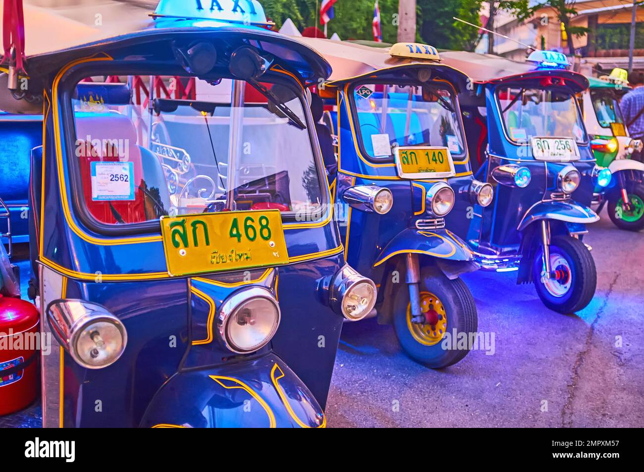 CHIANG MAI, THAILAND - MAY 3, 2019: Closeup of parked blue tuk tuks, on ...