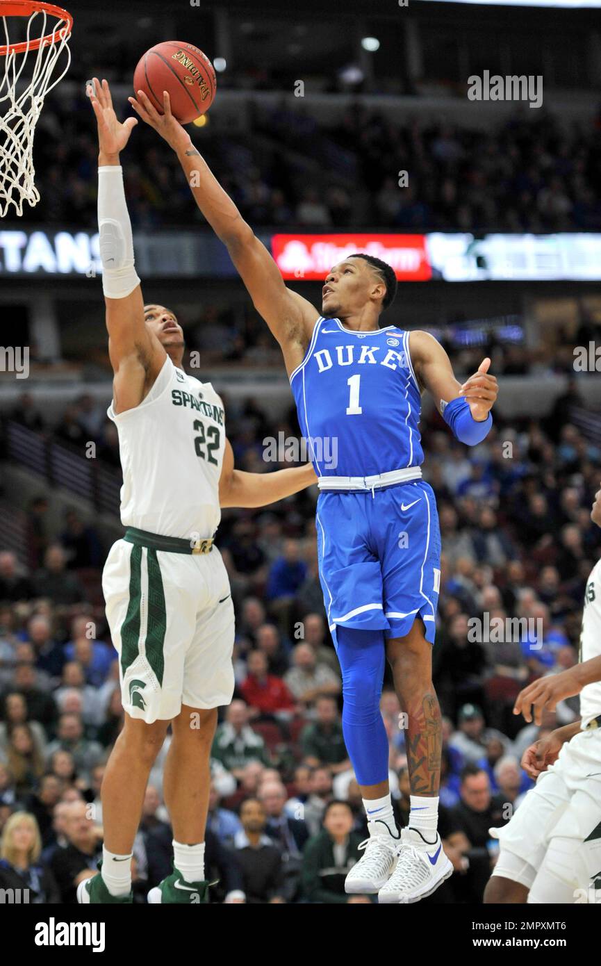 Duke's Trevon Duval (1) shoots over Michigan State's Miles Bridges ...