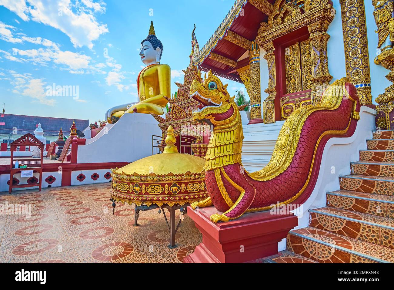 The red-gilt statue of Mom mythical creature at the upper viharn of Wat ...