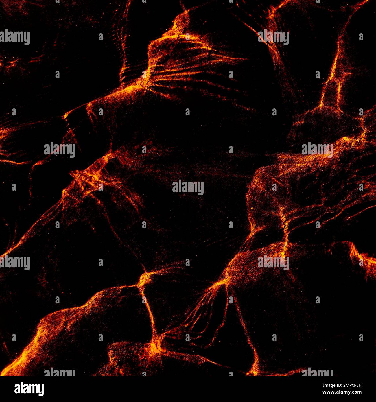 Abstract surface textures with a black background and a bright red glow ...
